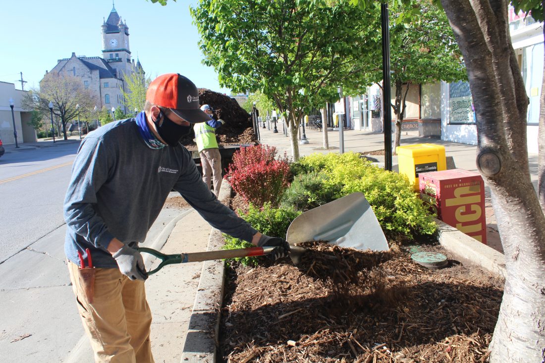 Crews prepare downtown Lawrence for spring flowers | News, Sports, Jobs ...
